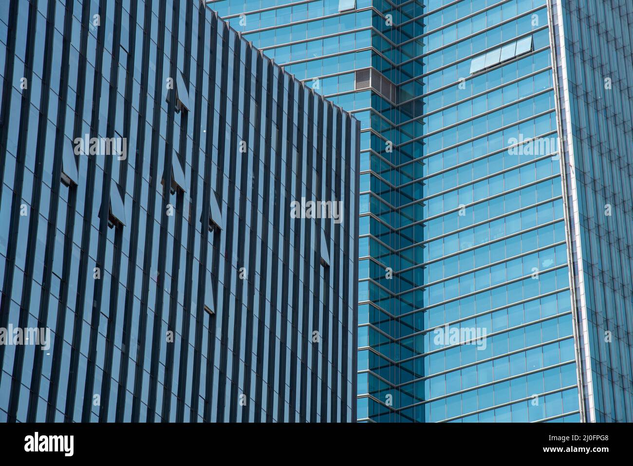 Modern glass skyscraper building with open windows Stock Photo - Alamy