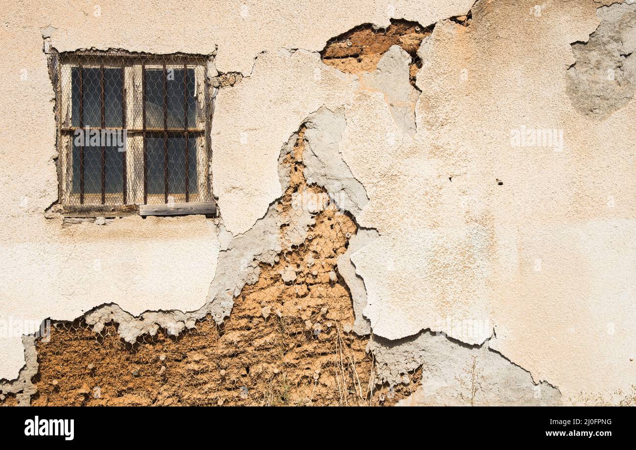 Damaged wall background with a closed window Stock Photo - Alamy
