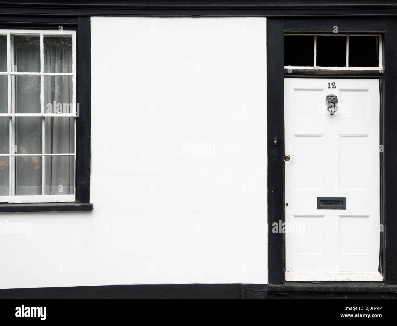 British house white and black entrance Stock Photo - Alamy
