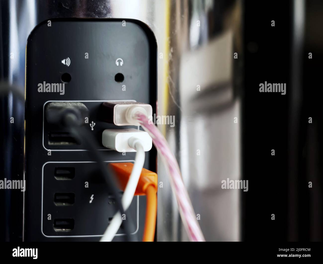 USB cables connected to the rear panel of a computer with the empty ...