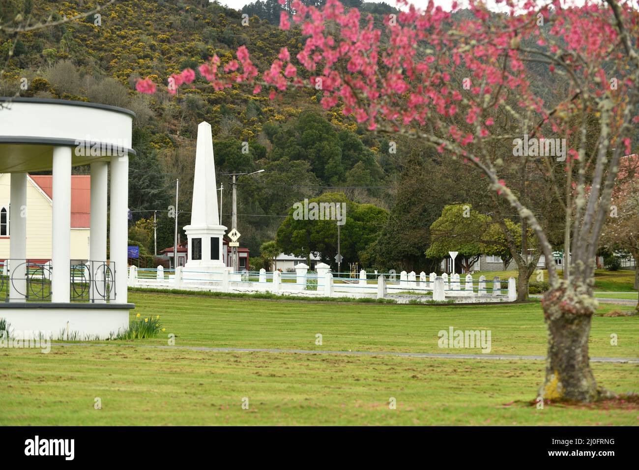 Cherry blossoms frame the water memorial in Reefton, New Zealand Stock ...