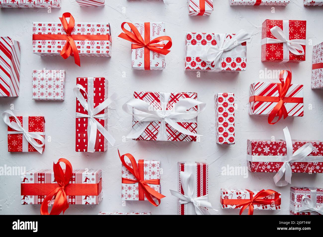 Various pattern and size Christmas boxes placed on white background ...