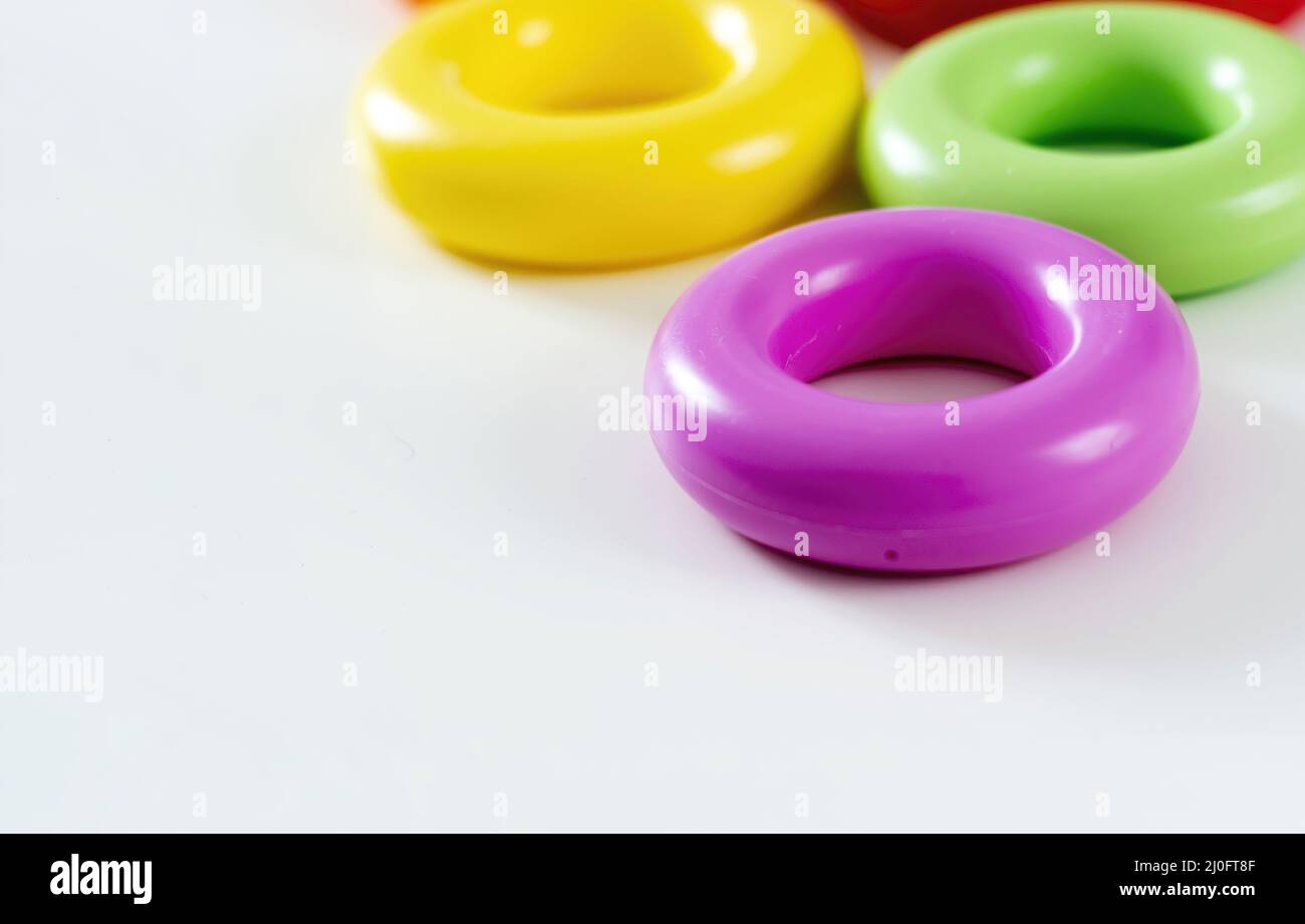 Colorful plastic rings isolated on a white background Stock Photo - Alamy
