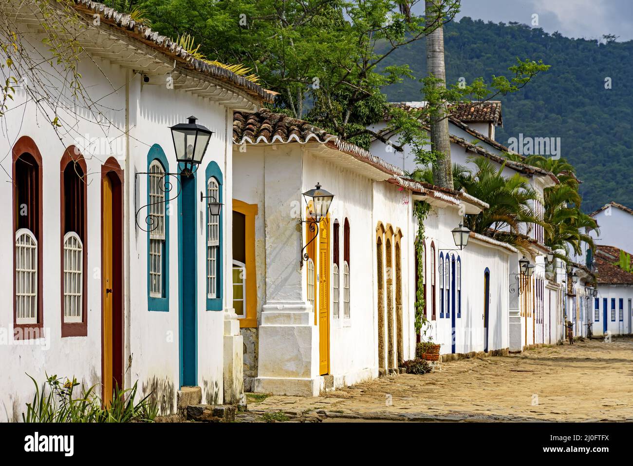 House facade in colonial architecture on cobblestone street Stock Photo ...