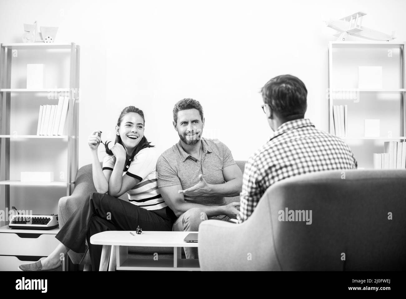 Family psychologist. Psychotherapy with young couple. Couple telling ...