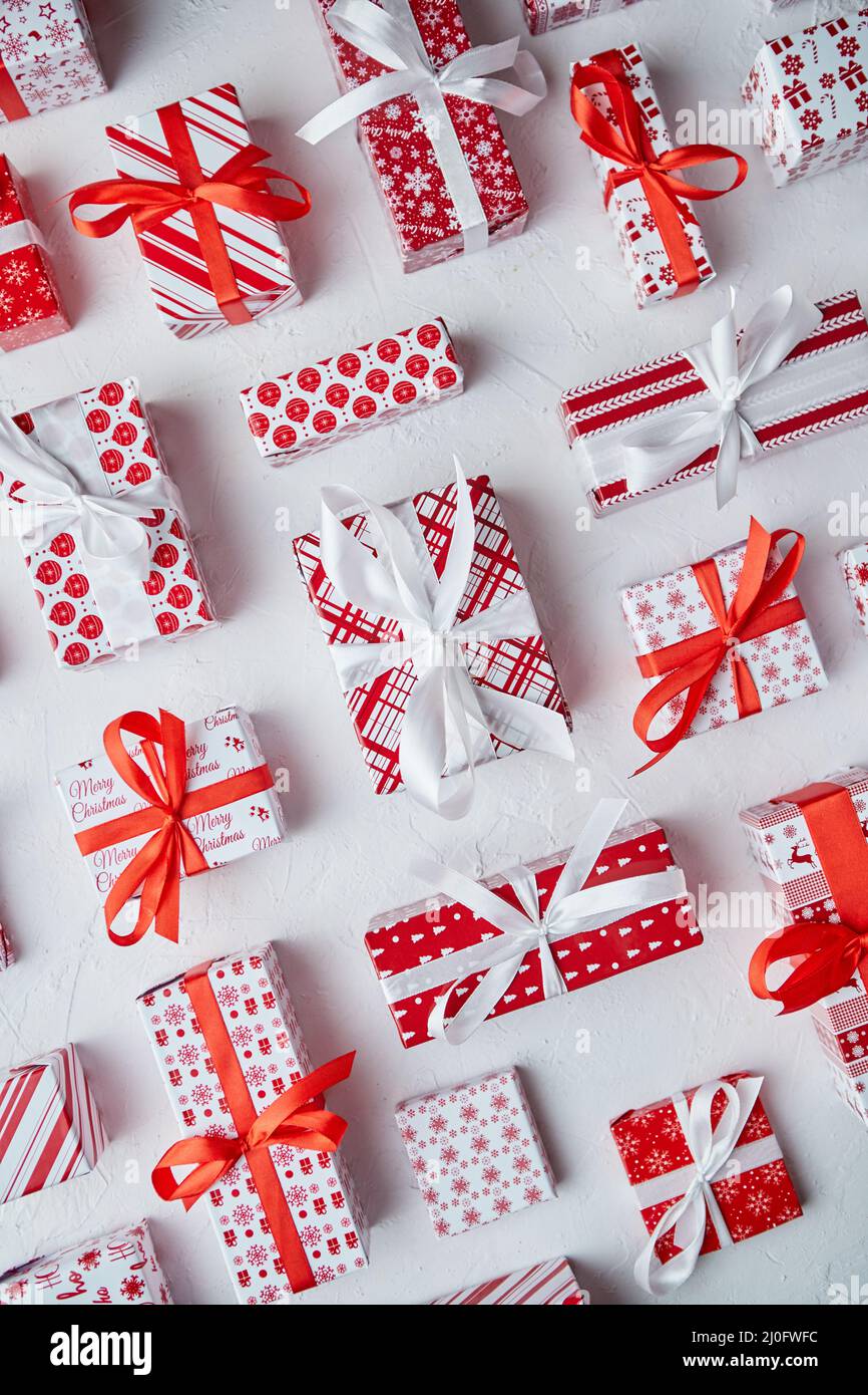Various pattern and size Christmas boxes placed on white background ...