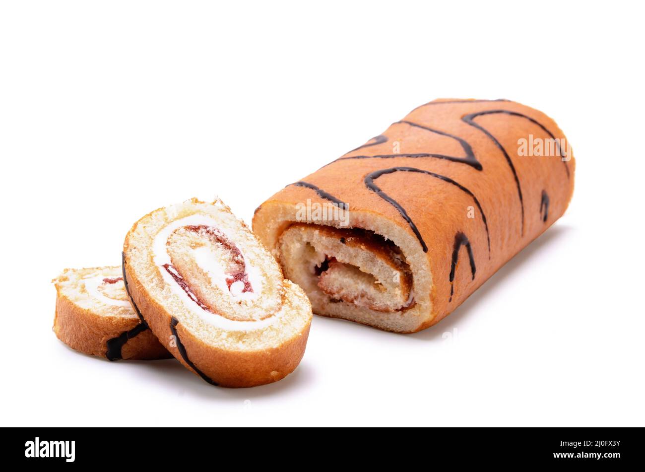 Sponge cake roll on white background Stock Photo - Alamy