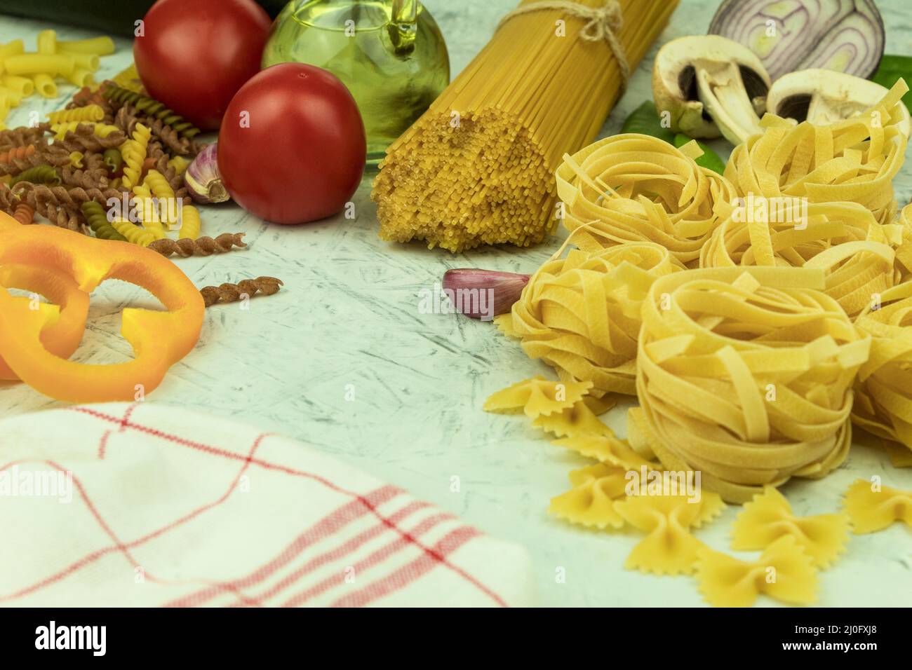 Assorted different types of pasta on the table. Various types of raw ...