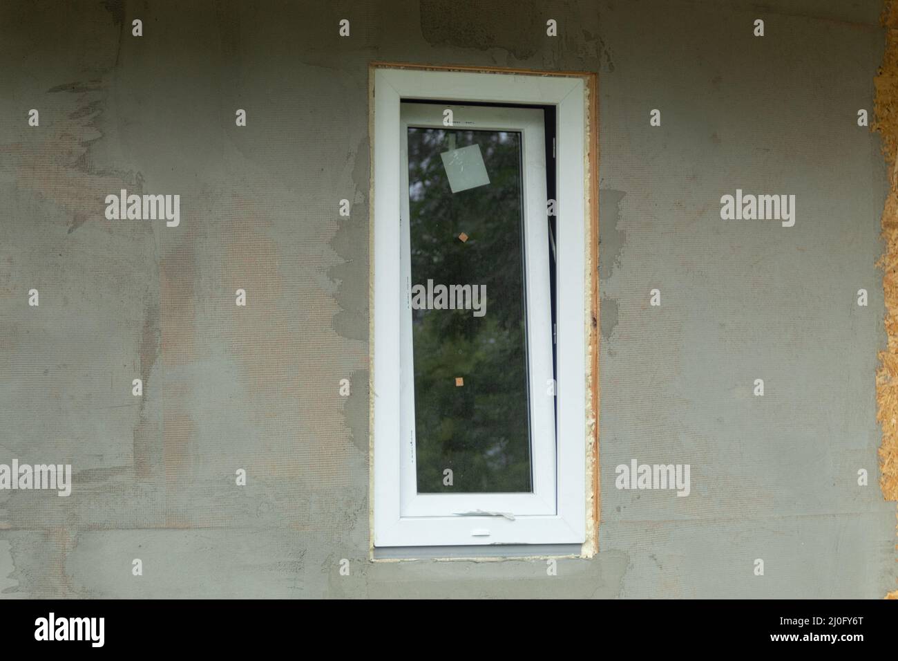White metal-plastic window in a new building. Window installation ...