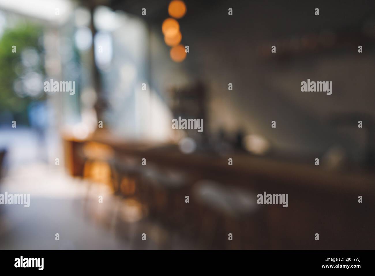 Blur coffee shop or cafe restaurant interior a loft style open coffee ...