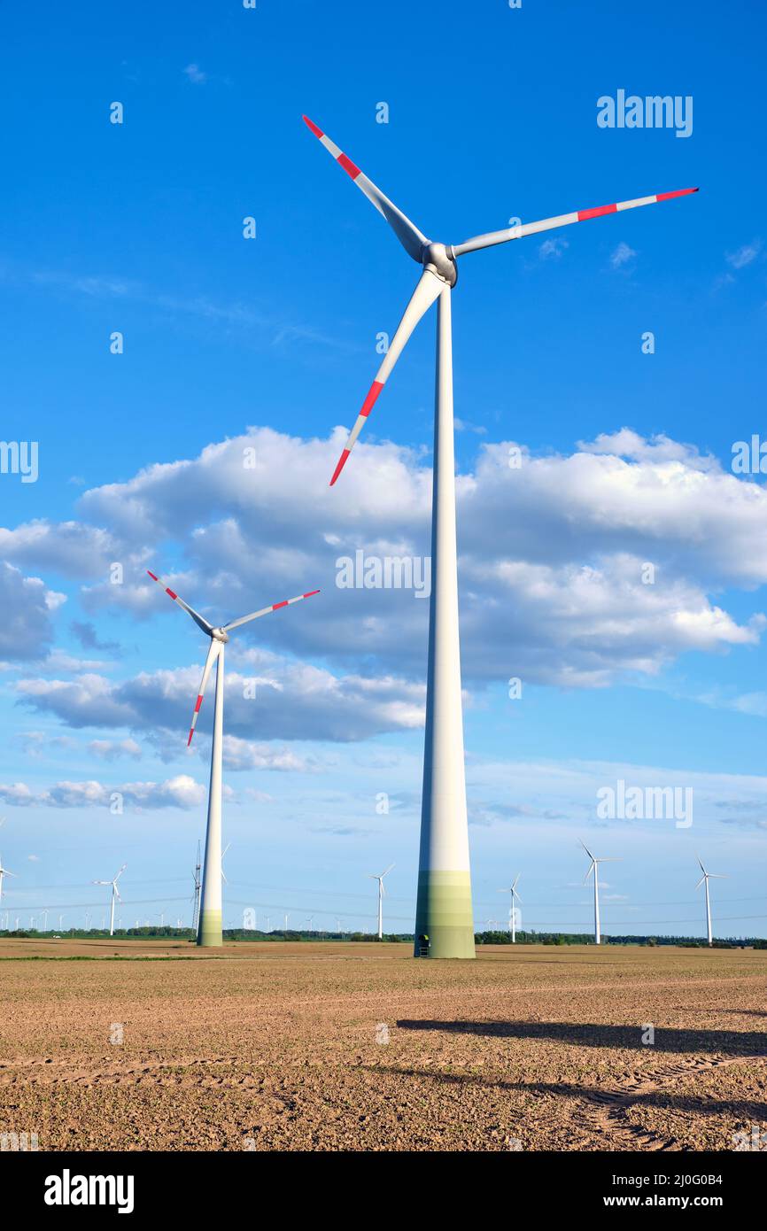 Wind wheels in a barren field seen in Germany Stock Photo - Alamy