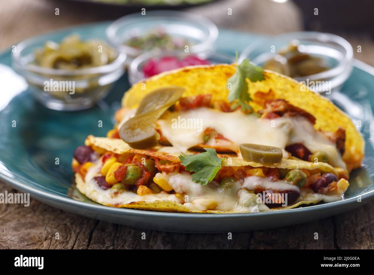 Mexican tacos au gratin with cheese Stock Photo - Alamy