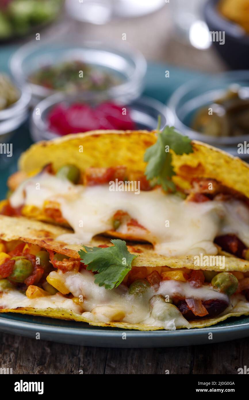Mexican tacos au gratin with cheese Stock Photo - Alamy