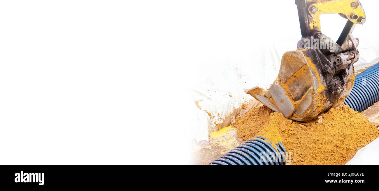 The road excavator bucket distributes the sand, creating a fentry ...