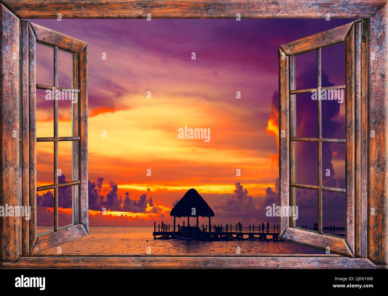 View from the open window of the caribbean sunset Stock Photo - Alamy
