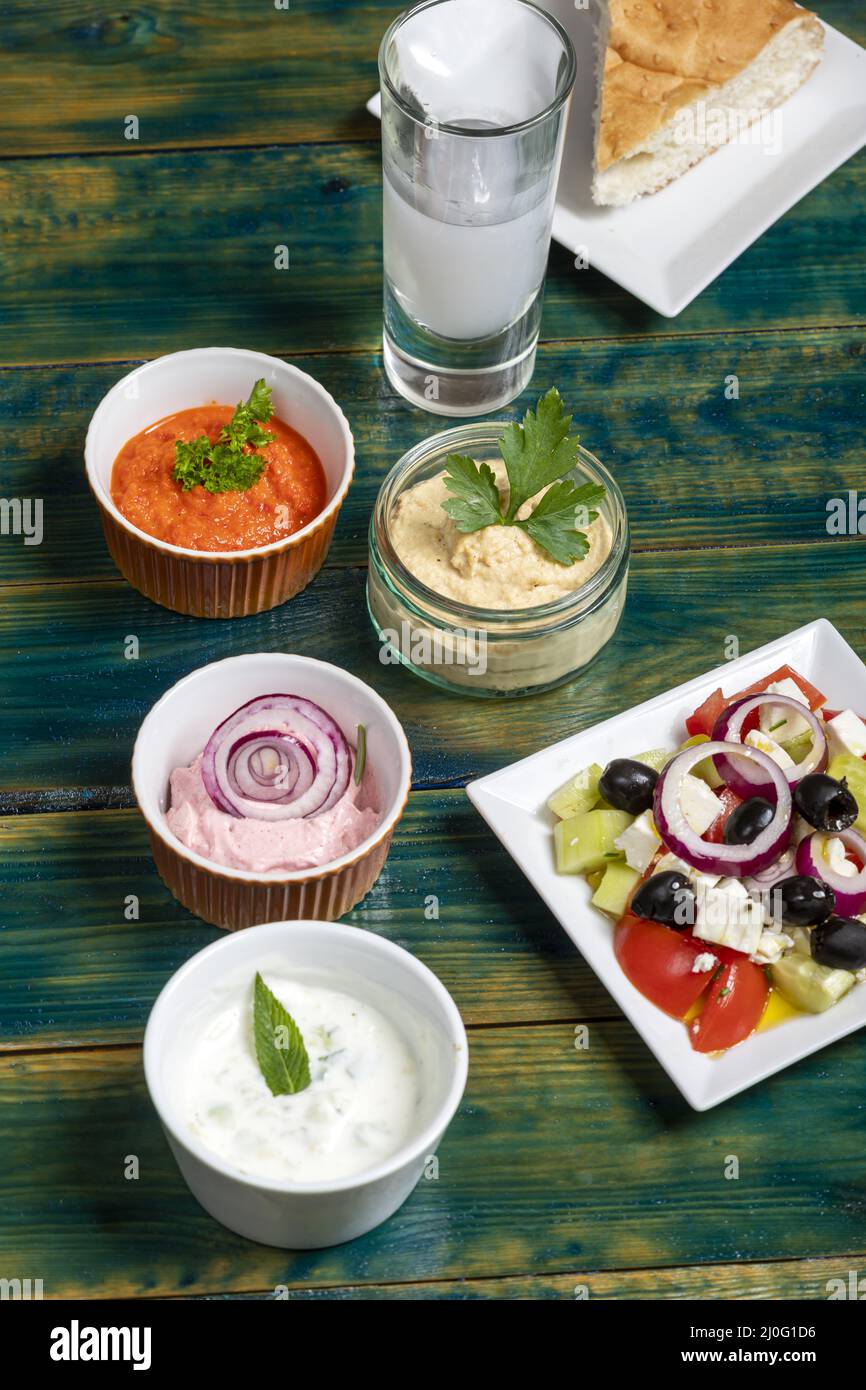 Greek starter on green wood Stock Photo - Alamy