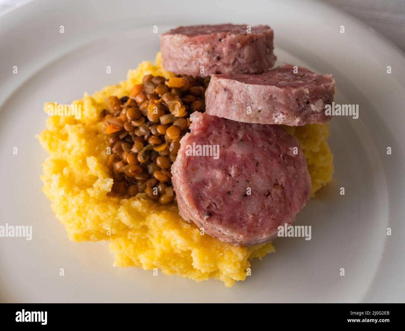 Cotechino, a large Italian Pork Sausage with Lentils and Polenta, a ...
