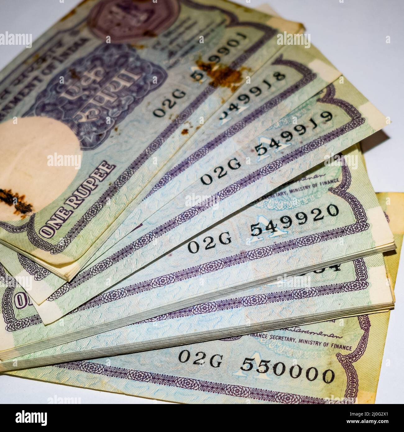 Old One Rupee notes combined on the table, India money on the rotating ...