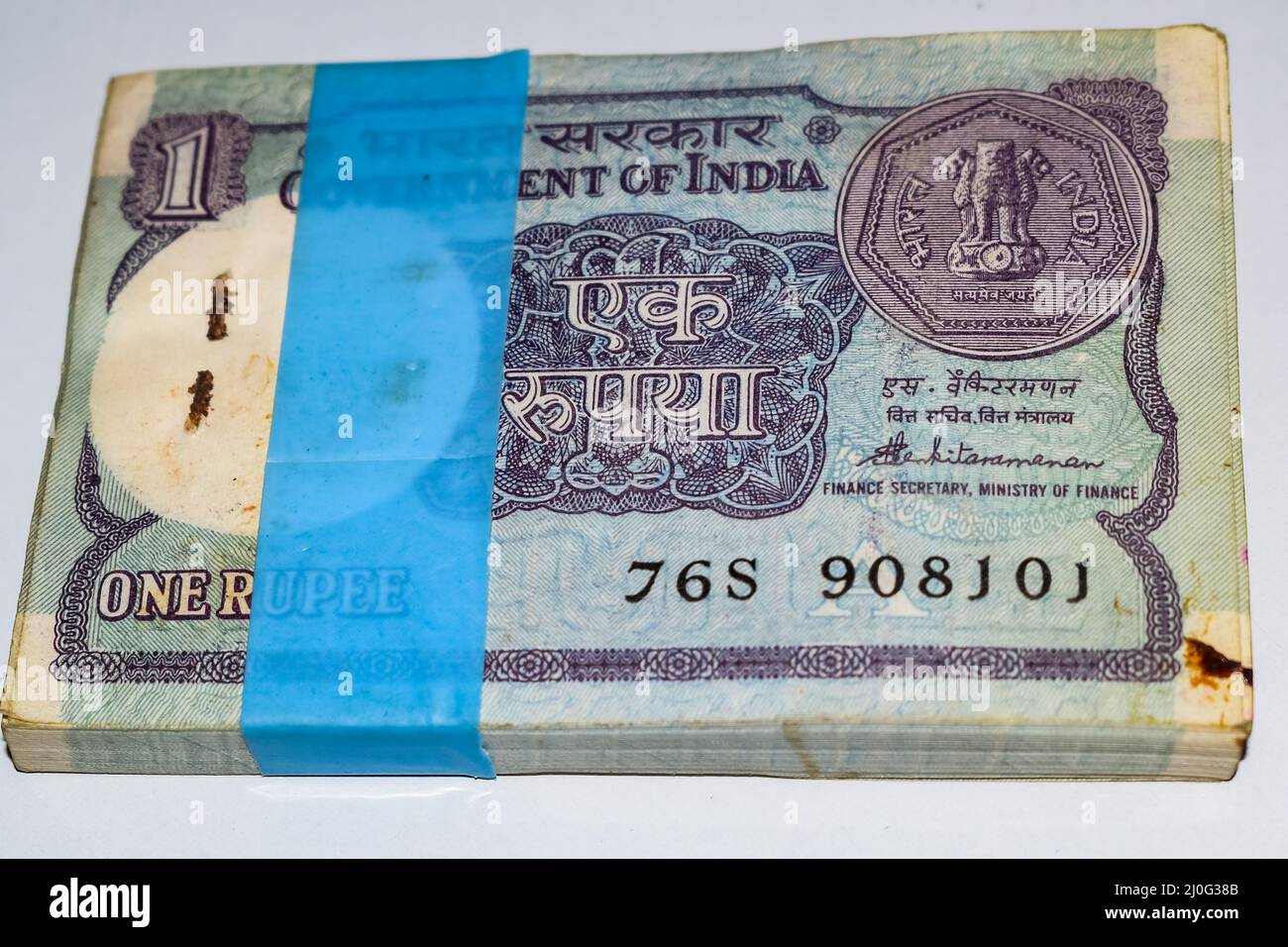 Old One Rupee notes combined on the table, India money on the rotating ...