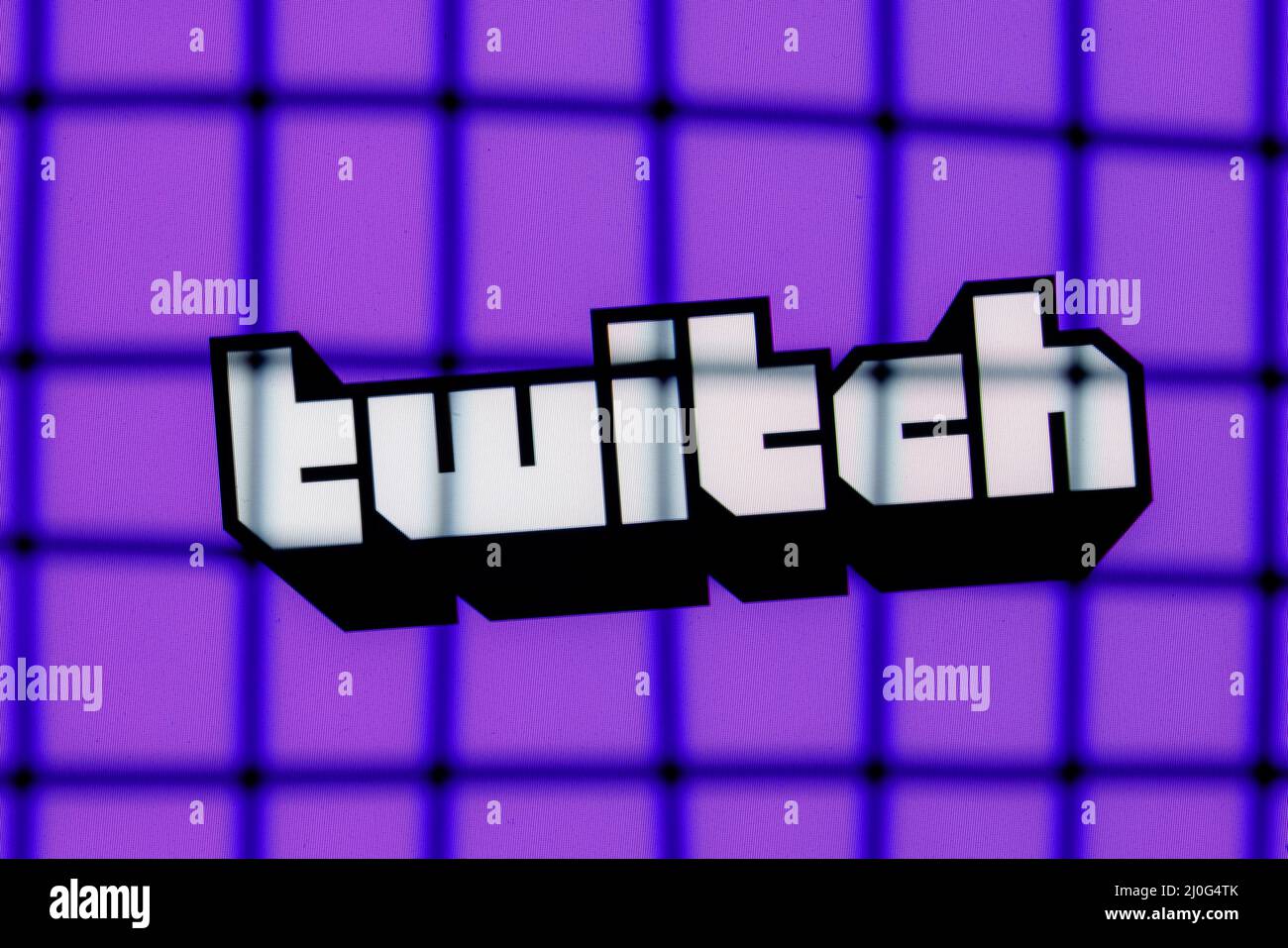 The logo of the live streaming service Twitch behind bars. The concept ...