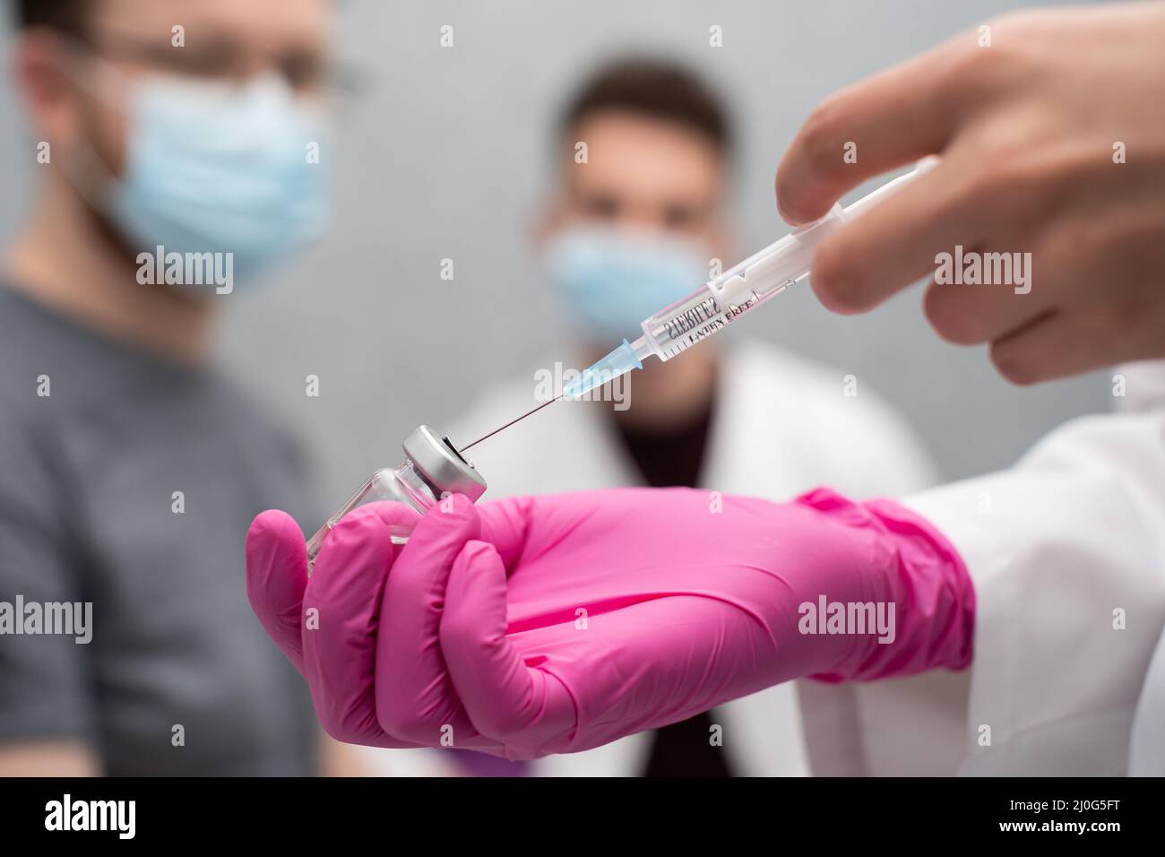 The doctor teaches interns in medicine how to take the contents from a ...