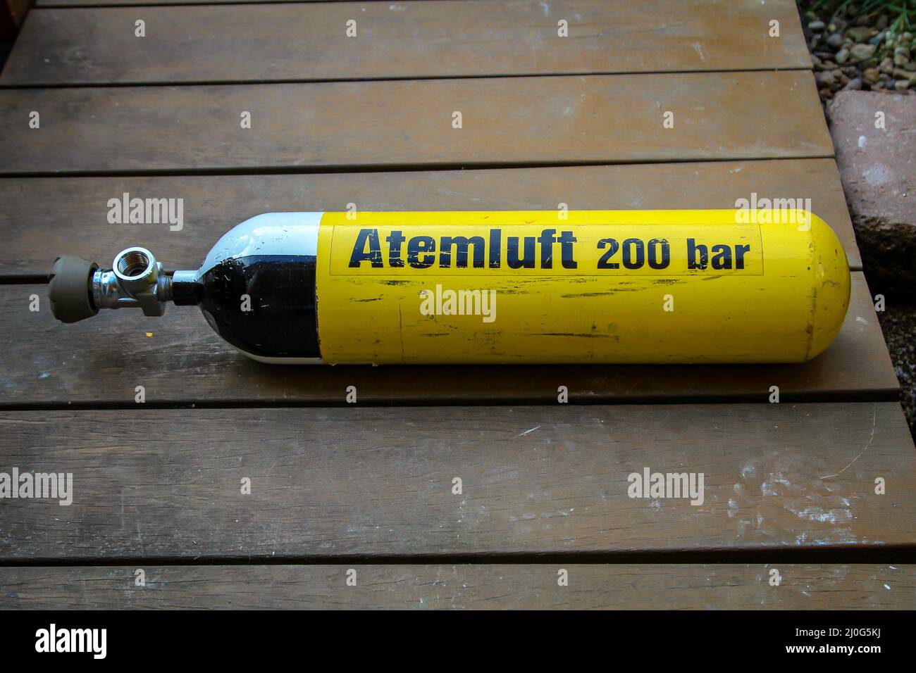 A diving bottle with breathing air lies on the landing stage Stock ...
