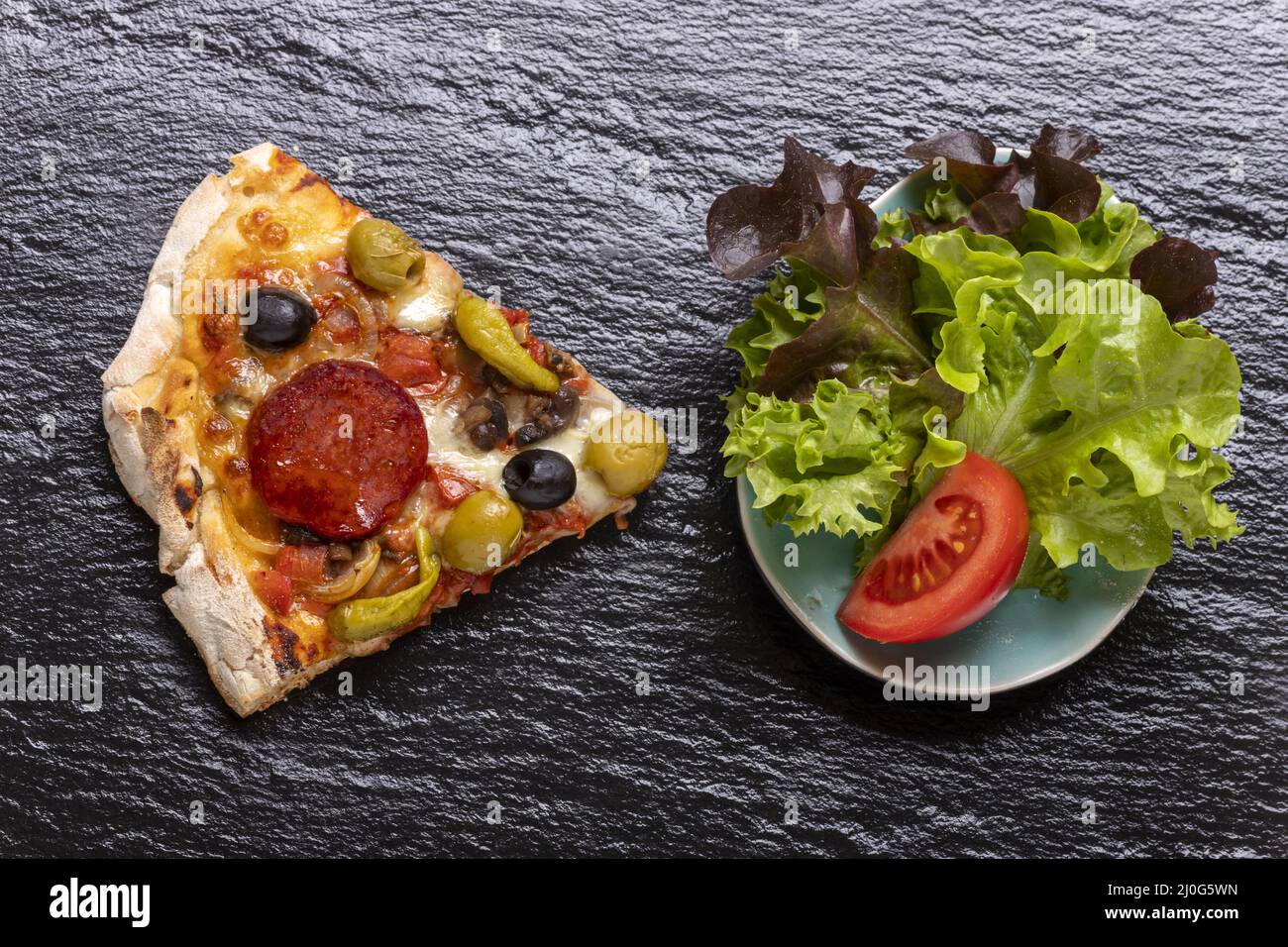 Pizza on slate Stock Photo - Alamy