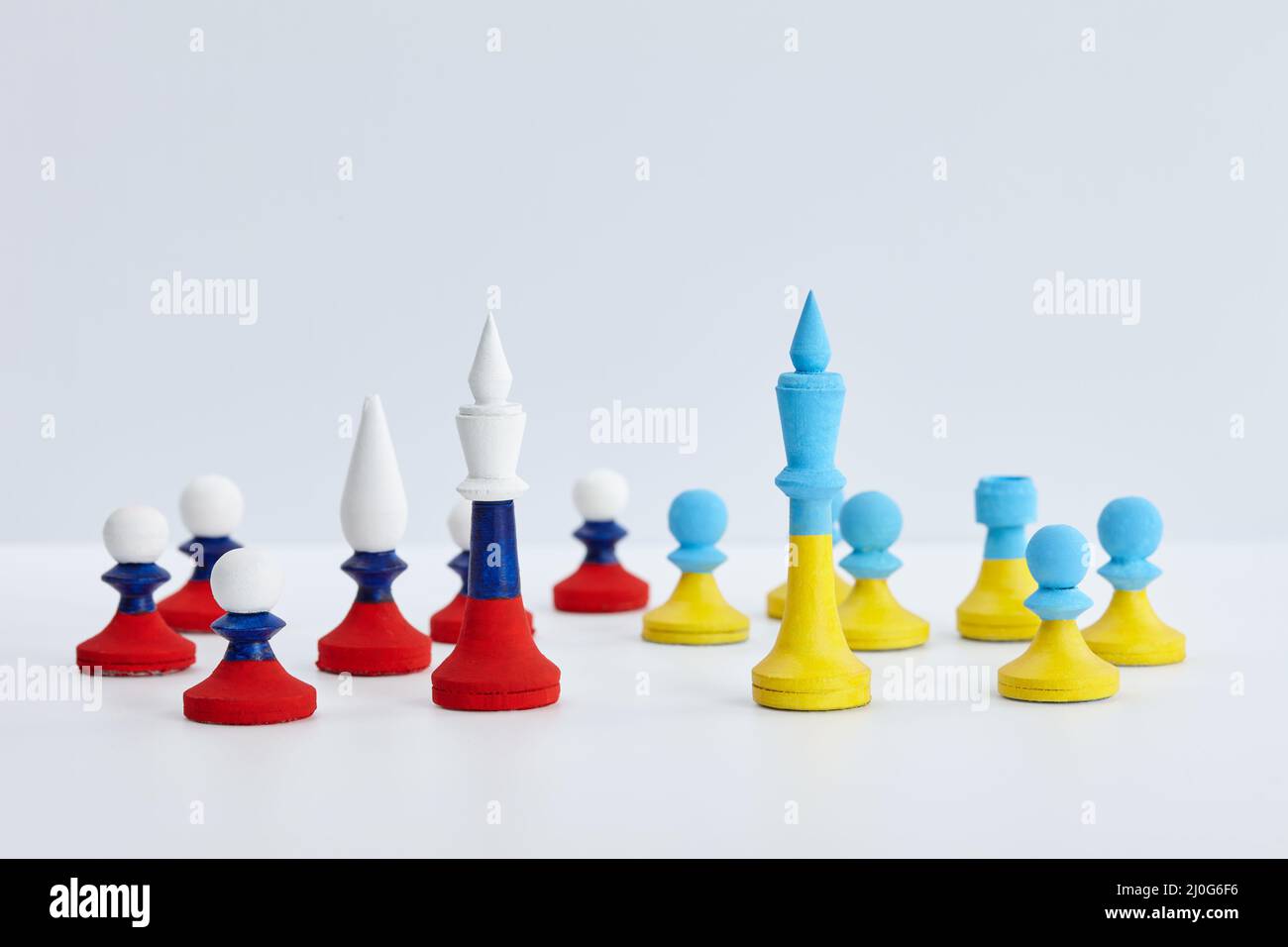 Ukrainian and Russian chess sets on white background Stock Photo - Alamy