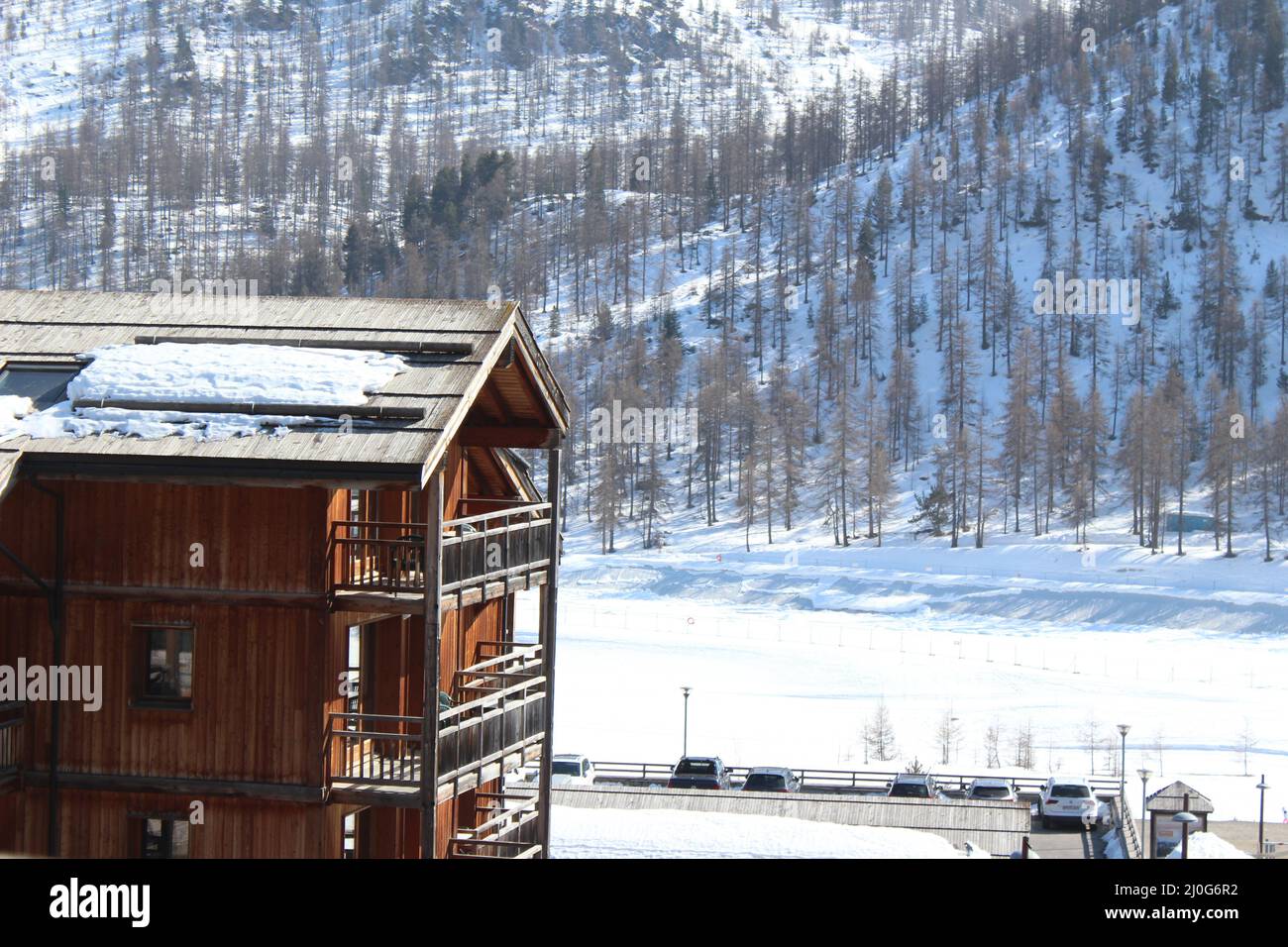 Scenic view of a large residential chalet with balconies on snow ...