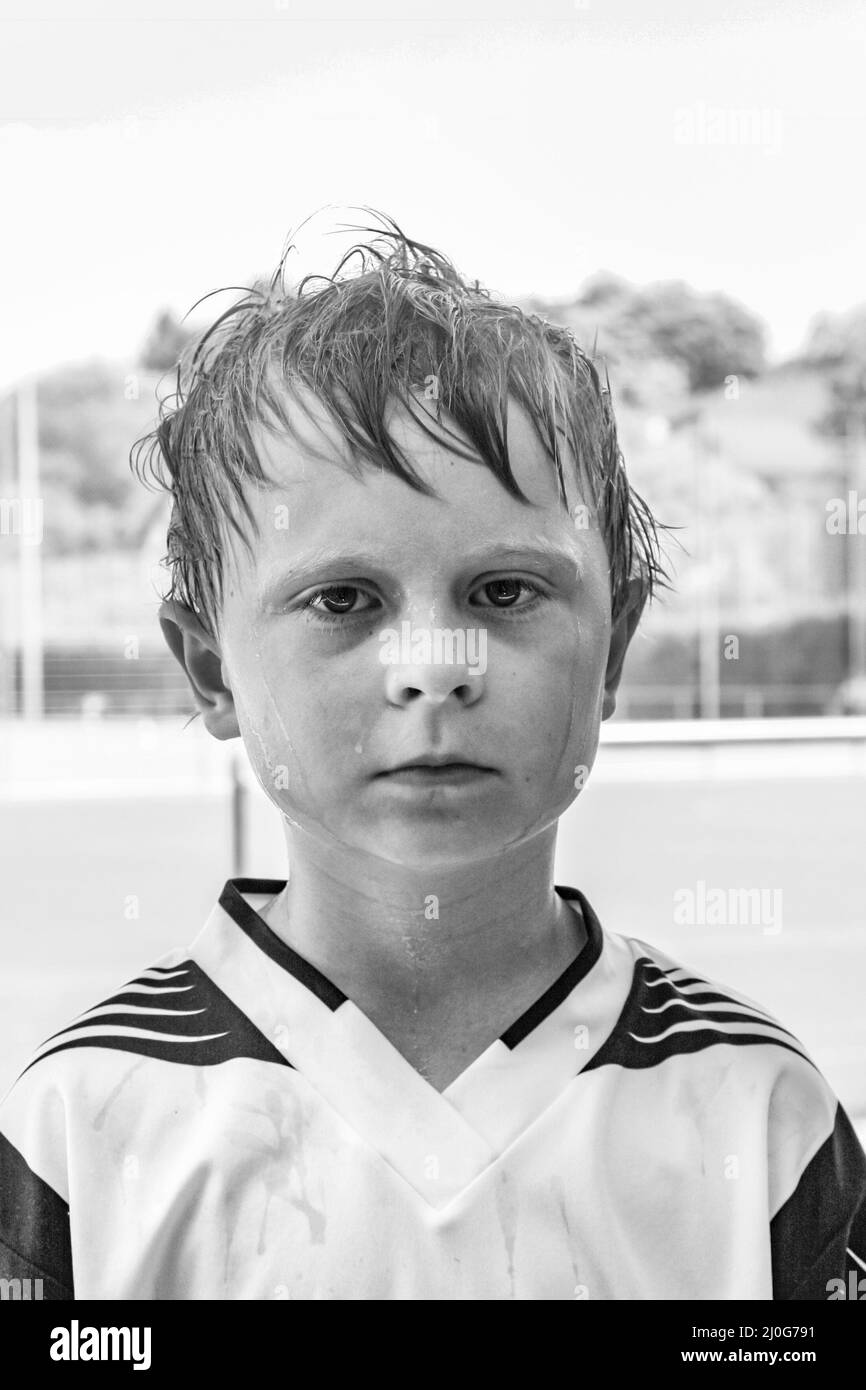 boy sweating and exhausted from playing soccer Stock Photo - Alamy