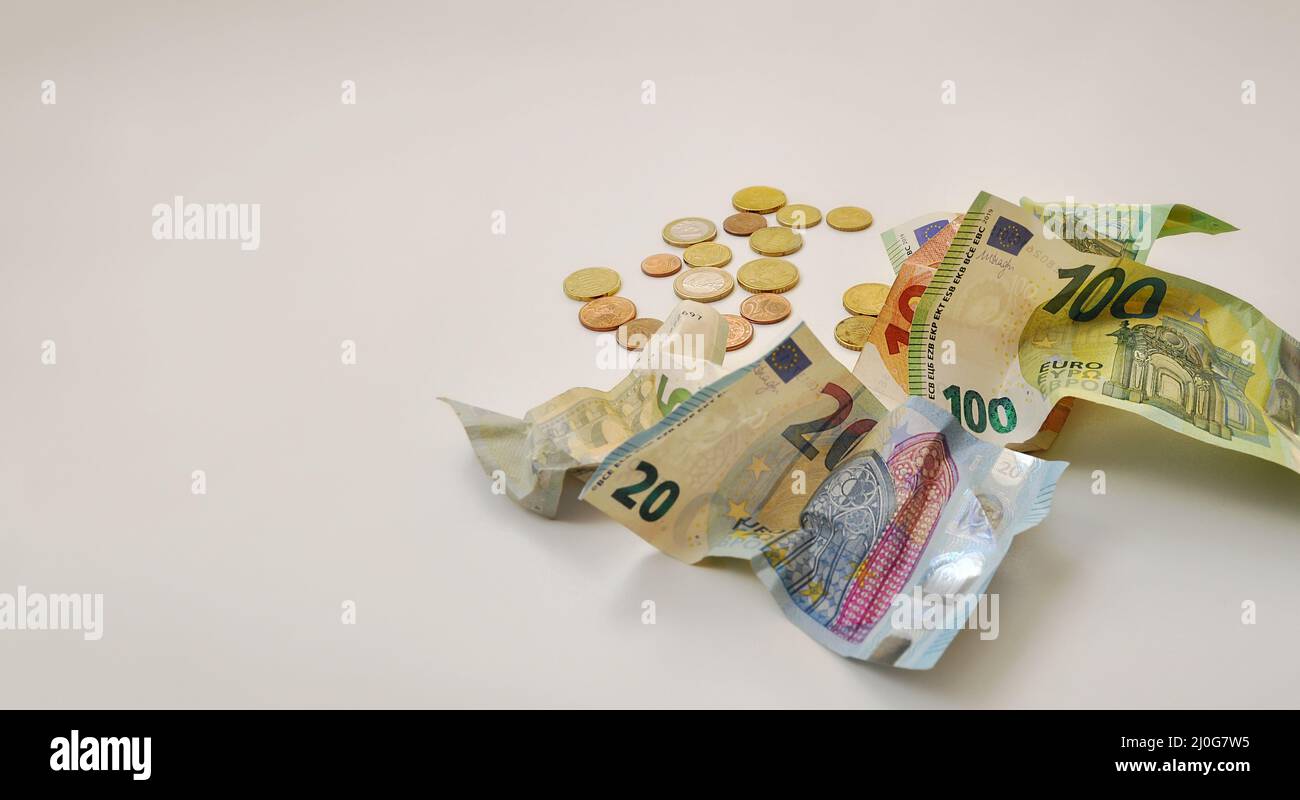 A pile of crumpled euro banknotes on a gray background. Minimalism ...