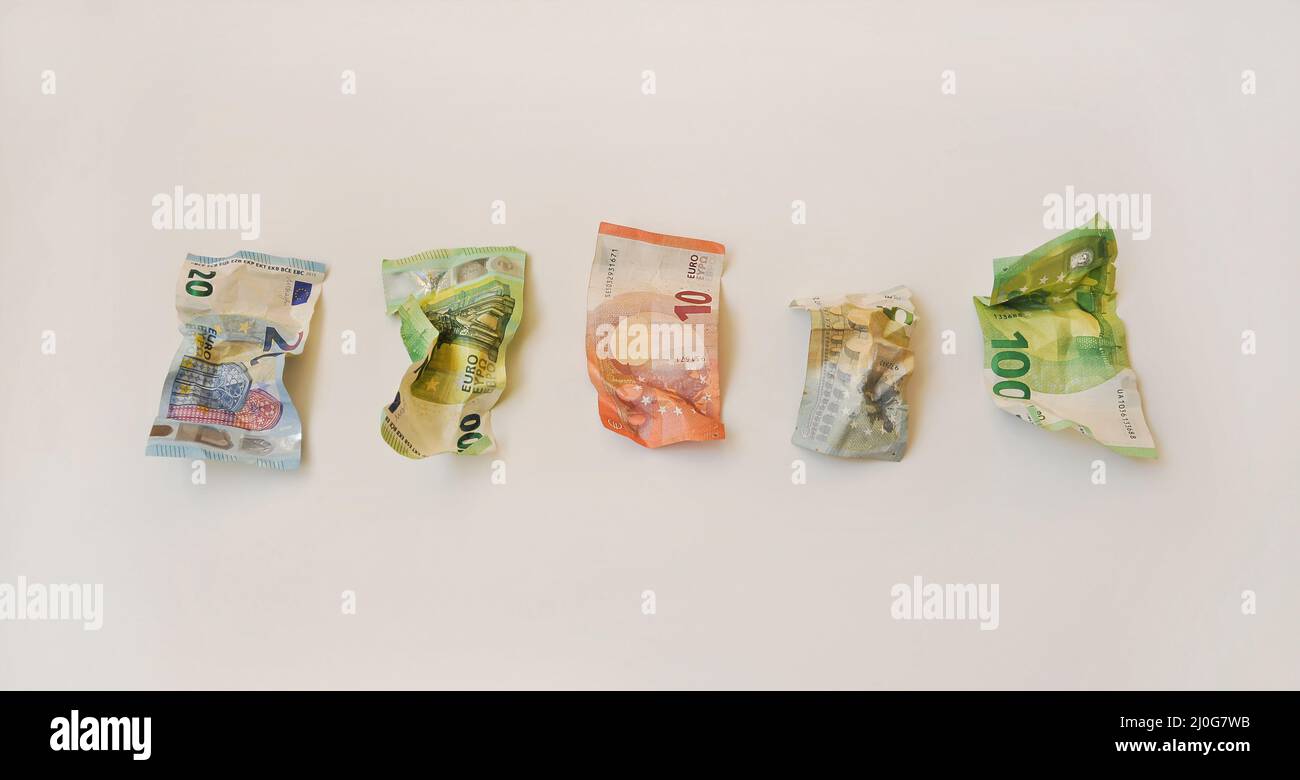 A pile of crumpled euro banknotes on a gray background. Minimalism ...