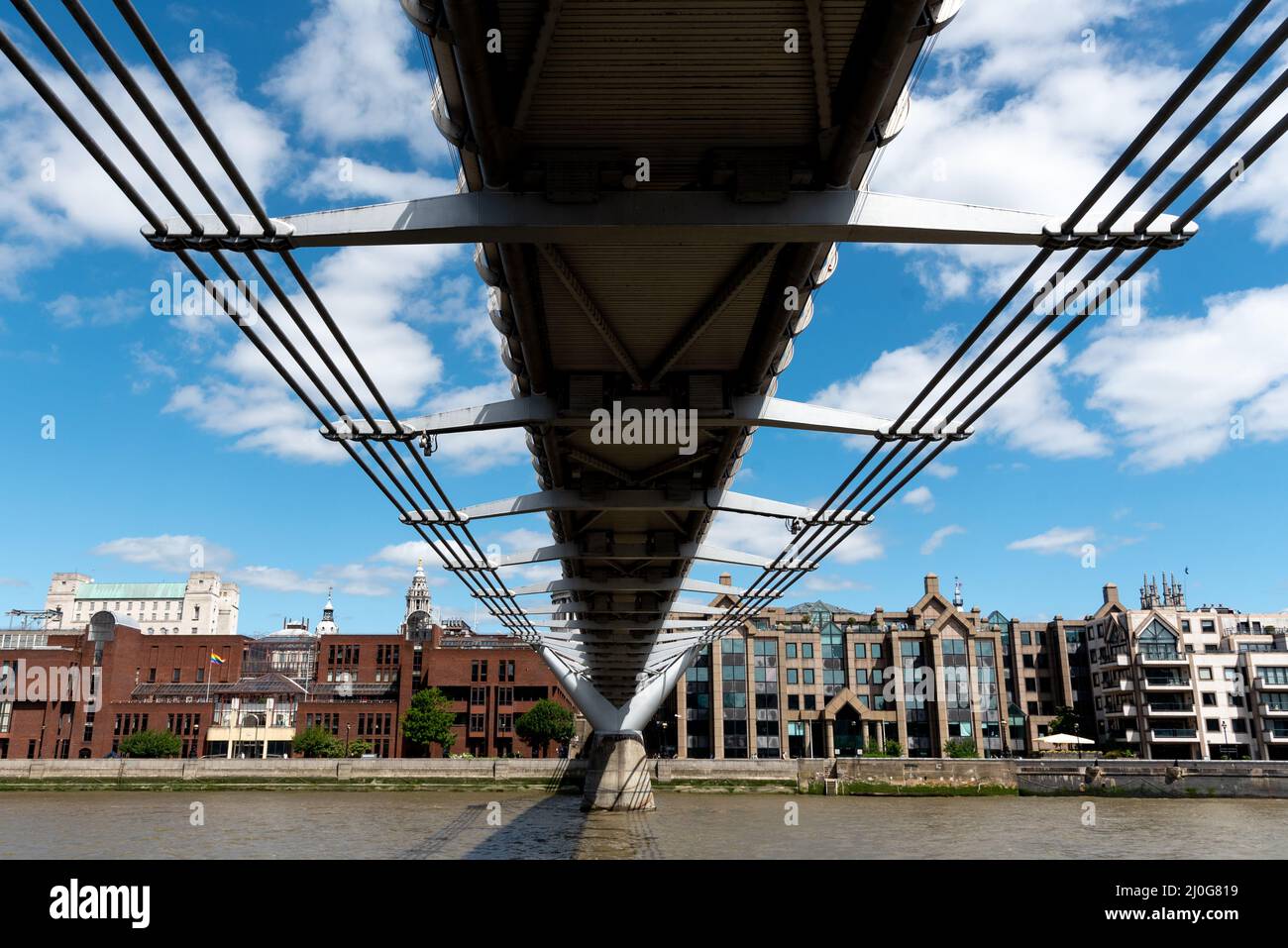 Skyline of London from under the millennium bridge in central London on ...
