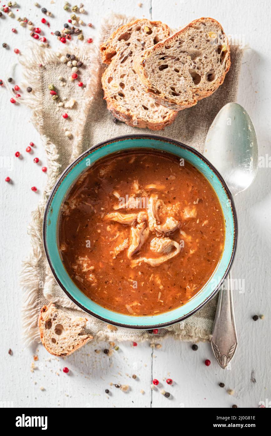 Homemade and spicy tripe soup served with bread and pepper. Spicy and ...