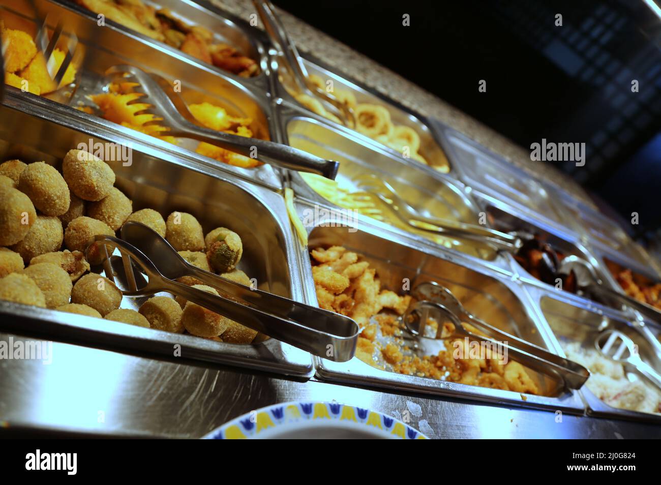 Chinese typical dishes in the canteen inside the stainless steel trays ...