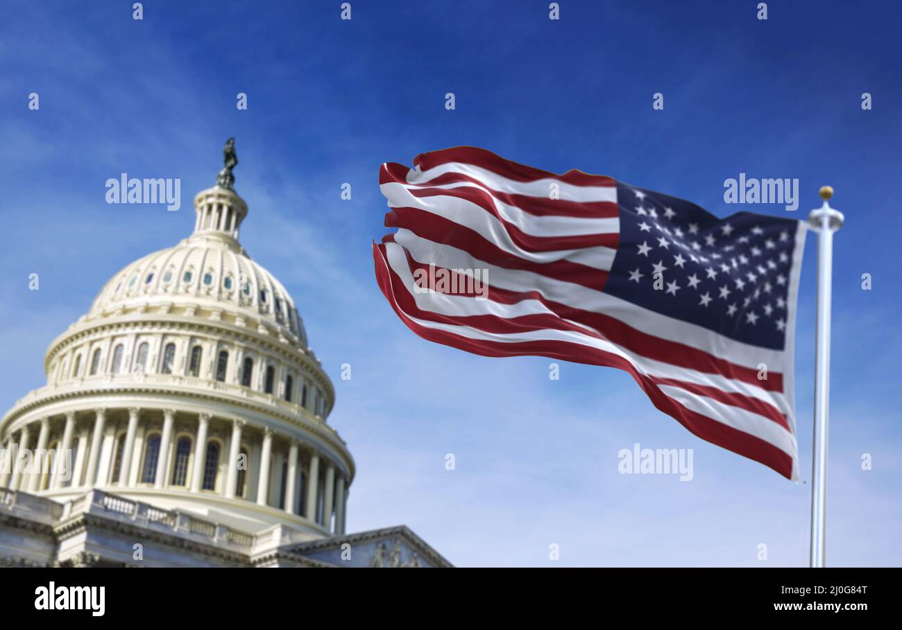 American flag waving with the US Capitol Hill Stock Photo - Alamy