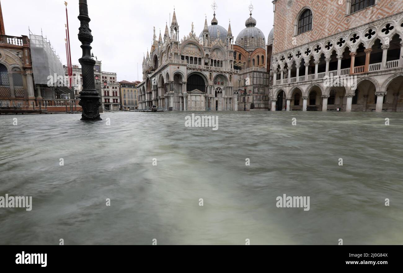 high tide in Venice Island in Northern Italy and the basilica of Saint ...