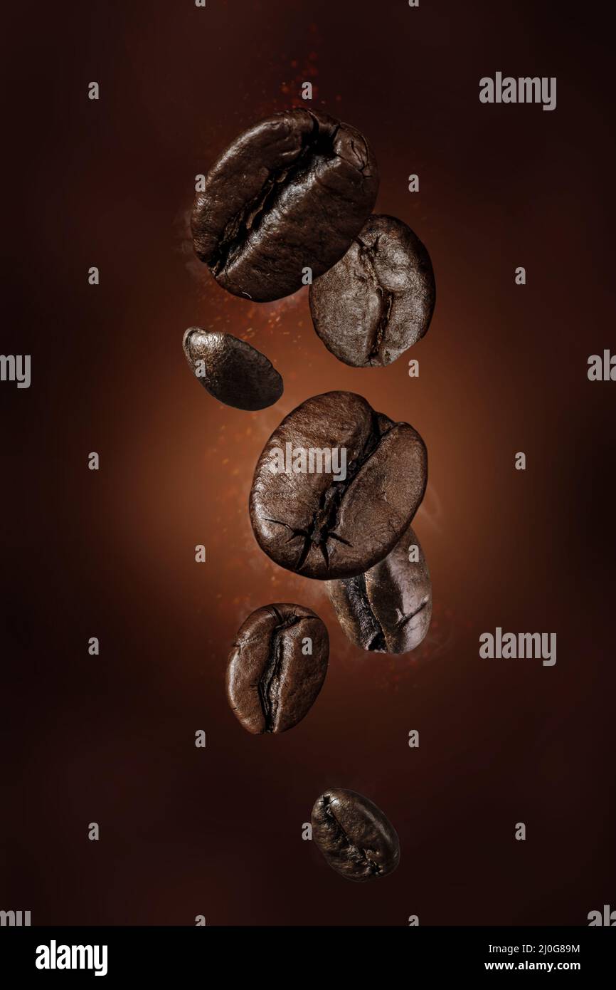 Fresh roasted falling coffee beans concept Stock Photo - Alamy