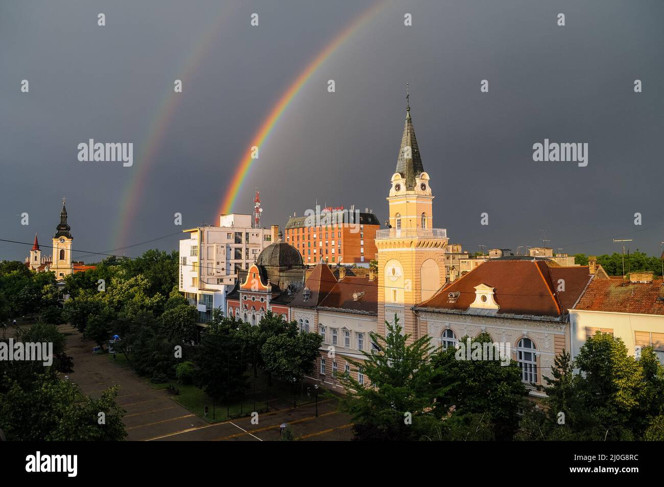 Scenic view of rainbow over beautiful architectural buildings in ...