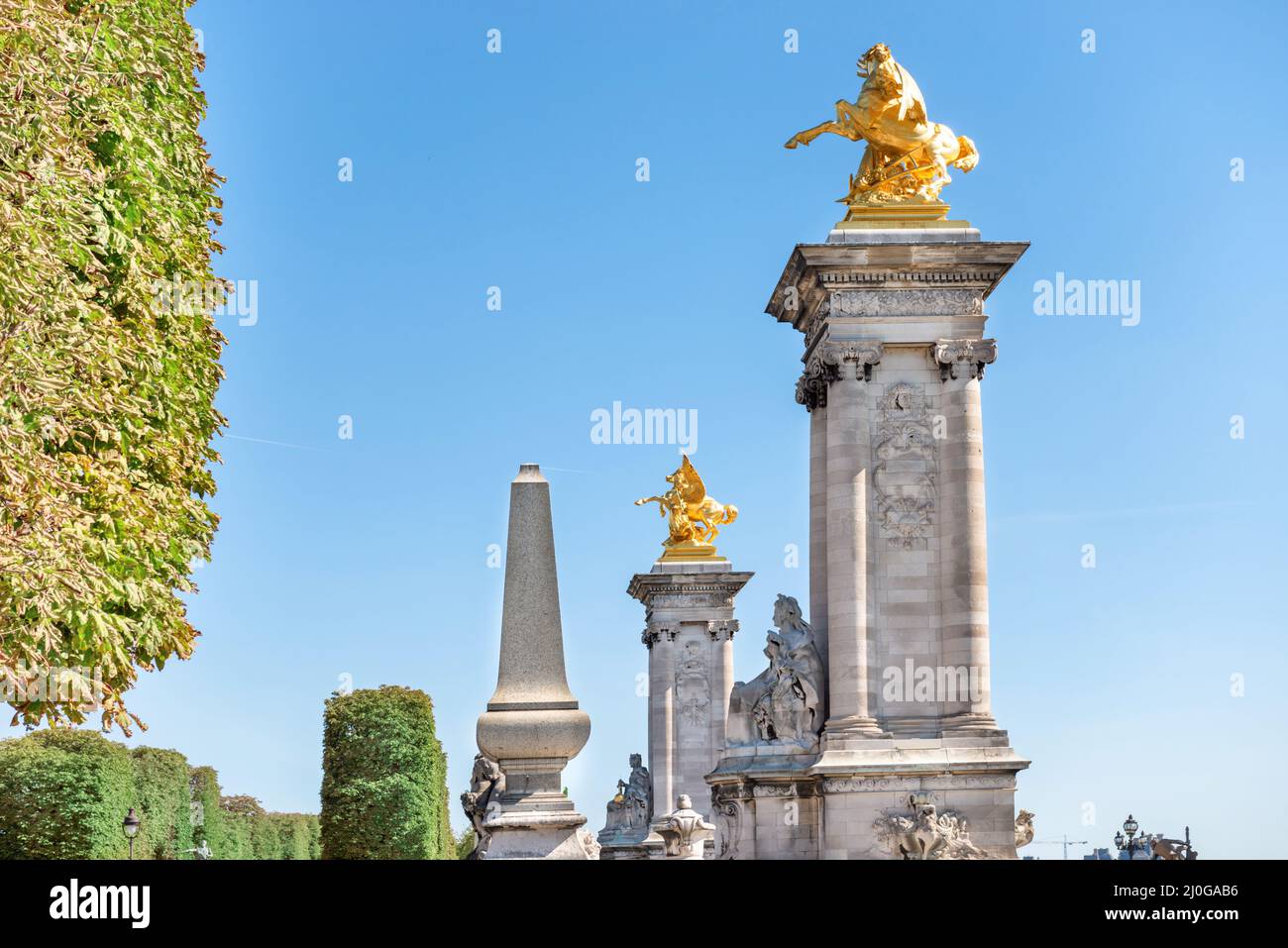 Golden statues on Alexandre III bridge Stock Photo - Alamy