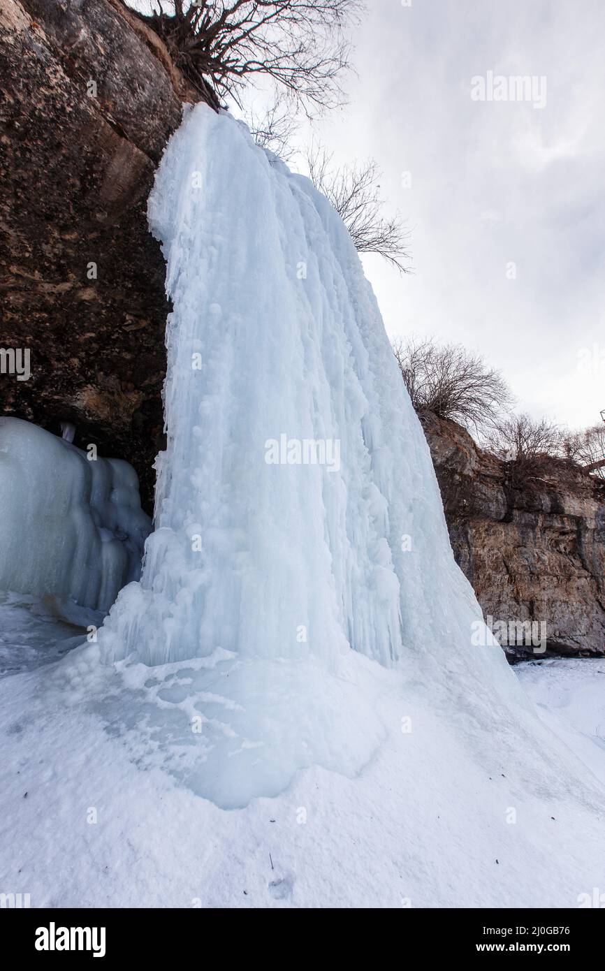 Waterfall with ice and snow in a forest hi-res stock photography and ...