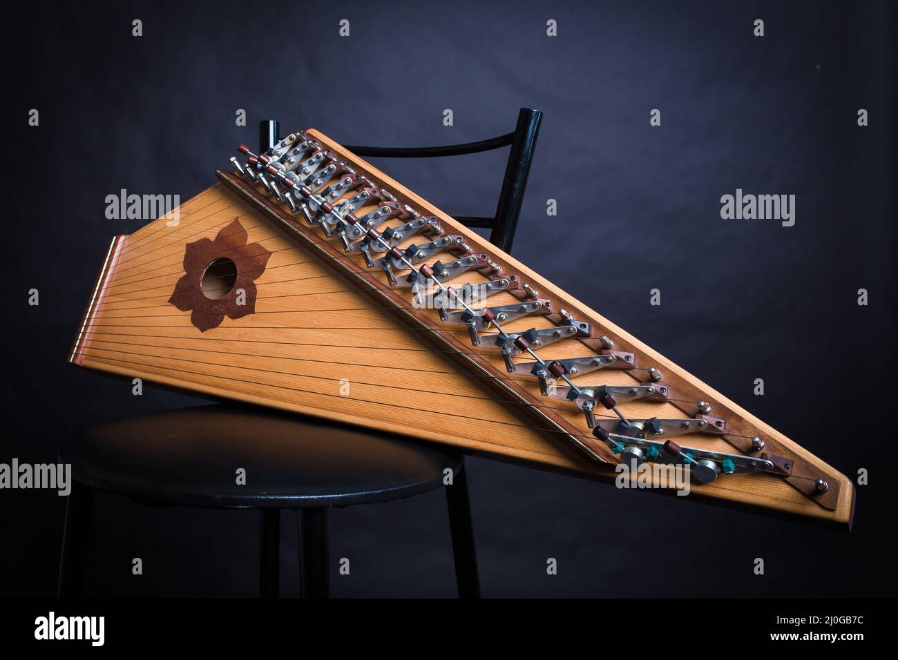 Russian folk musical instruments. Gusli isolated on a black background ...