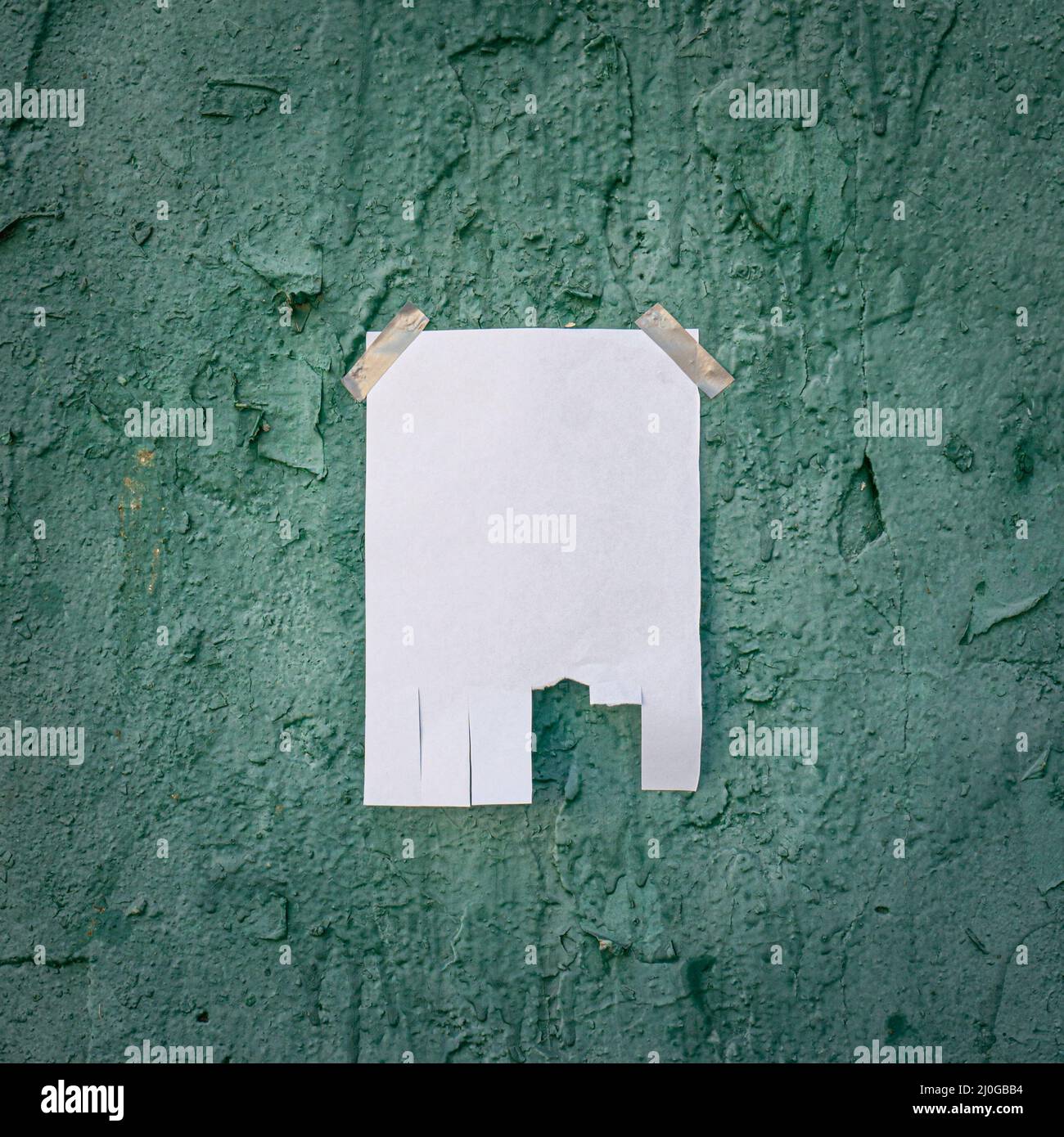 Tear off paper on paint wall. Mock up template. Street paper ad or ...