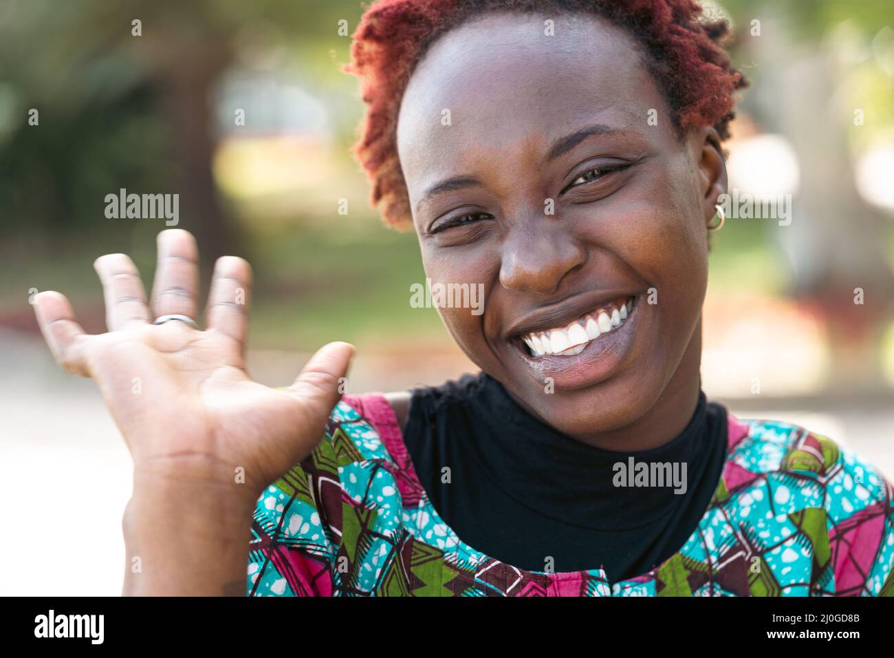 Beautiful African teenager with a big smile and a radiant expression on ...