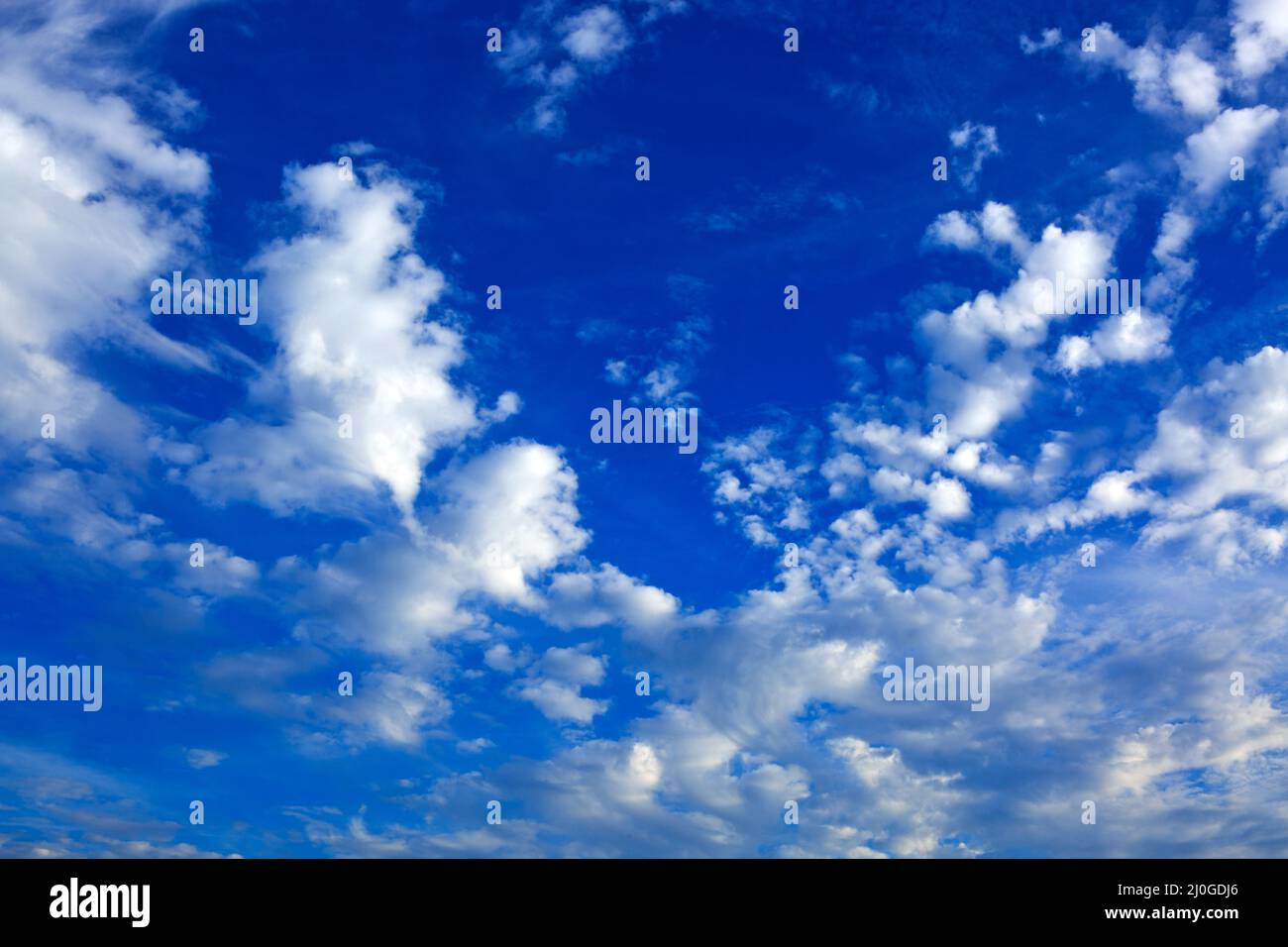 Clear blue sky with fluffy white clouds hi-res stock photography and ...