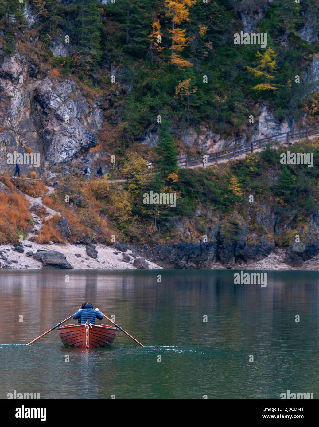 People boating at water of the Lago di Braise in the dolomite of the ...