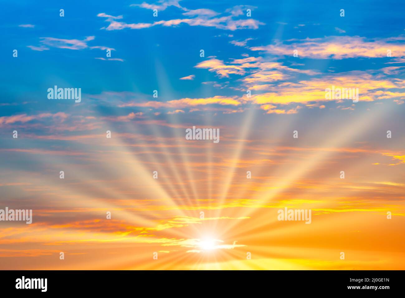 Sunset sky with sun rays Stock Photo - Alamy