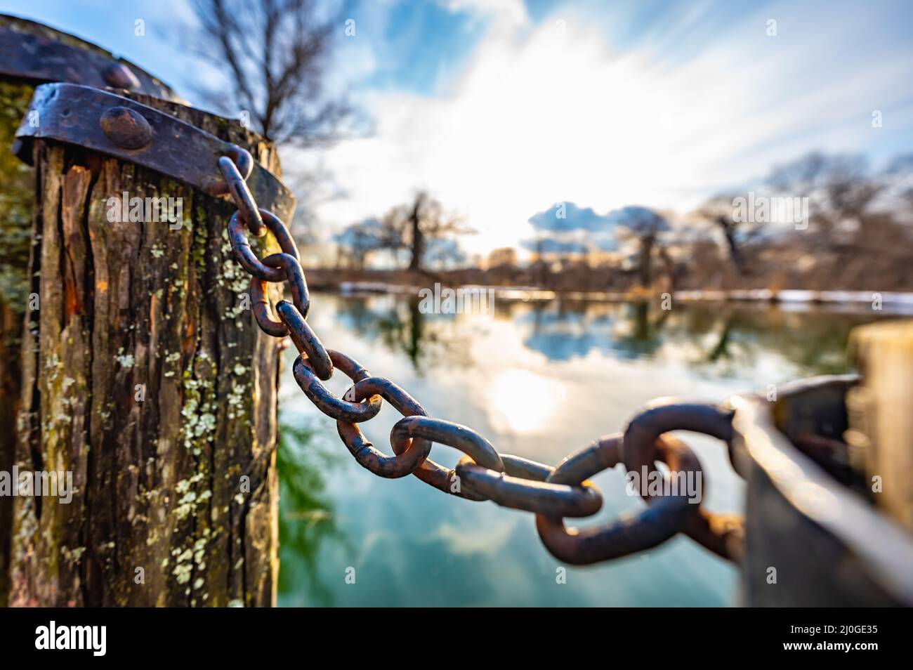 Old wooden pier with chain Stock Photo - Alamy