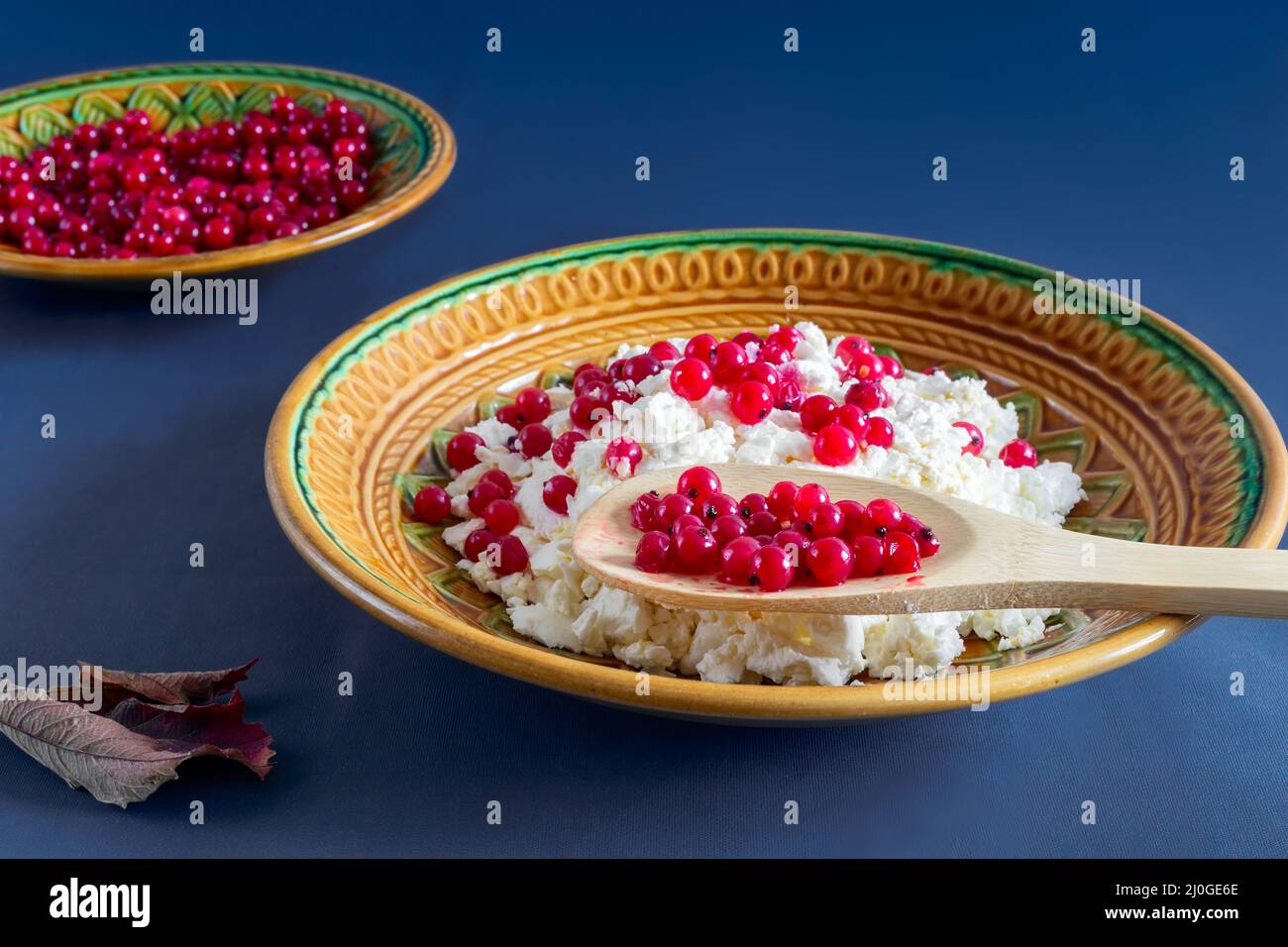 Delicious cottage cheese with red currant berries Stock Photo - Alamy