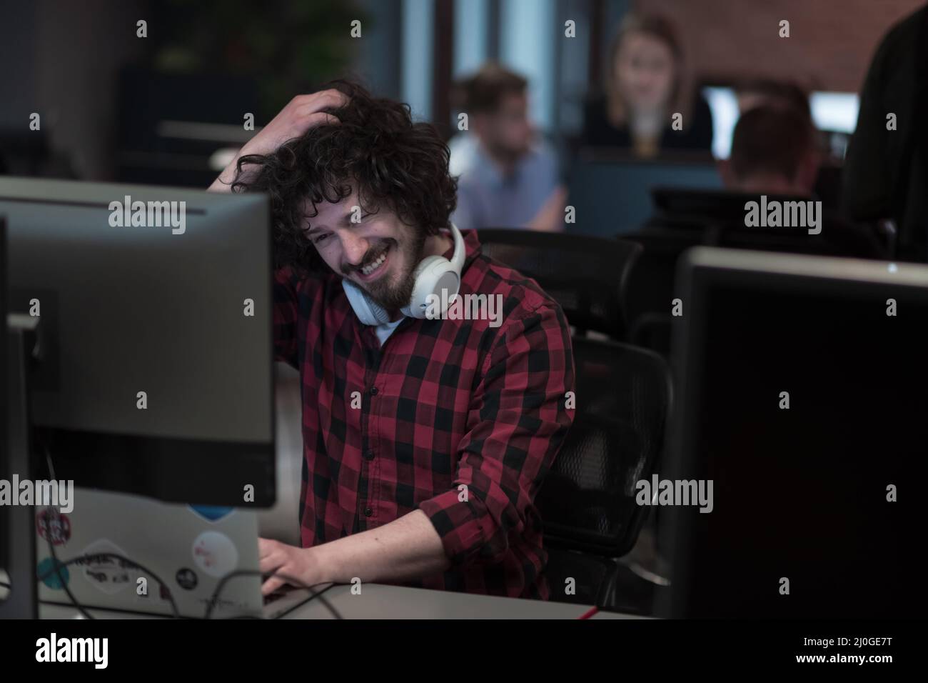 Disappointed businessman wearing headset having virtual team meeting ...